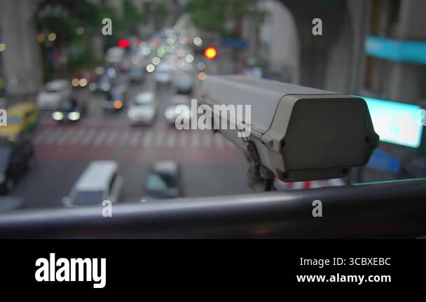 A surveillance camera meticulously captures the flow of traffic at a ...