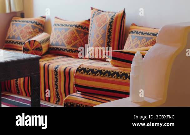 Traditional Moroccan interior design with colorful patterned cushions ...
