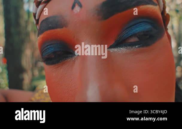 A stunning macro shot focuses on the dramatic eye makeup of a ...