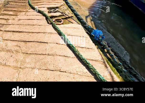 A boat approaches and docks at the pier Stock Video Footage - Alamy