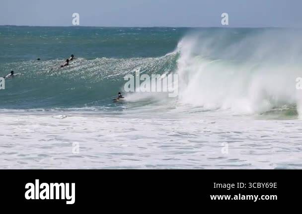 Bodyboarder surfing massive cyclone-generated waves at Kirra Beach ...