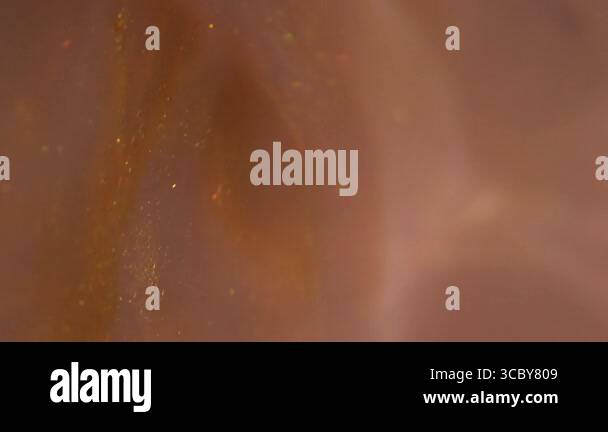 Ink stream. Sparkling paint. Defocused yellow orange colorful chemical ...