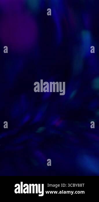 Vertical video. Defocused fragmented light. Strobe rotation. Rays pass ...