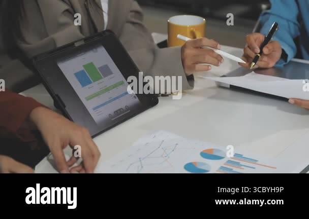 business team meeting in office with tablet and computer on desk Stock ...