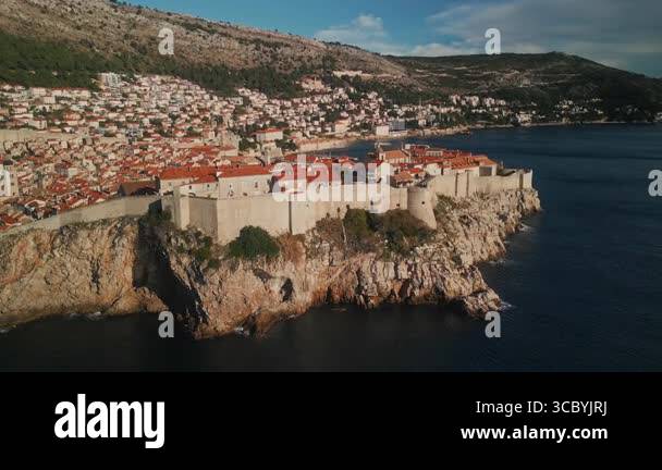 Old St Lawrence fortress with neat town on steep cliff against ...