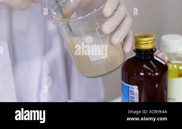 Mixing ingredients for a foamy chemical reaction Stock Video Footage ...