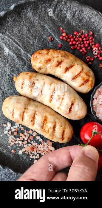 Grilled chicken or beef sausages, a hot meat dish cooked over a fire. Barbecued sausages Stock ...