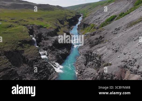 Aerial view of Studlagil Canyon in Iceland, showcasing basalt columns ...