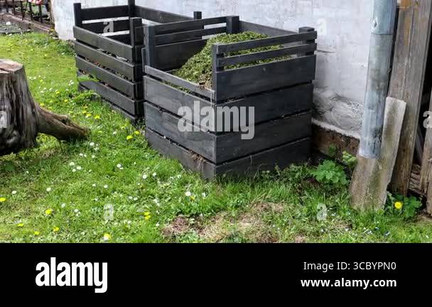 Two compost bins in the yard for garden and food waste Stock Video ...