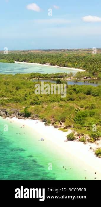 Drone view of tropical beaches with white sands and rocky coast ...