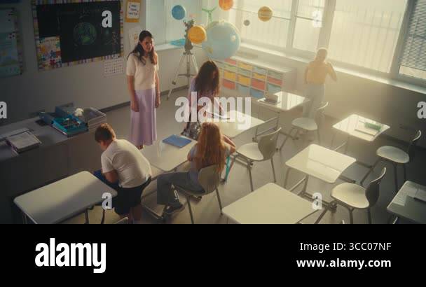 Female Teacher Finishing Lesson, Saying Goodbye to Group of Diverse ...