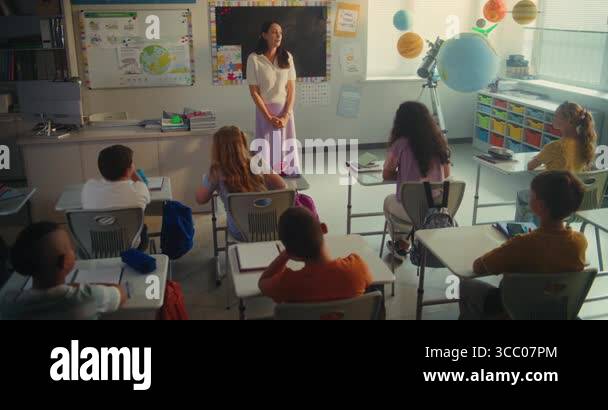 Environmental Science Lesson: Primary School Children Raising Hands ...
