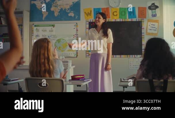 Female Teacher Calling Young Student to the Board During Environmental ...