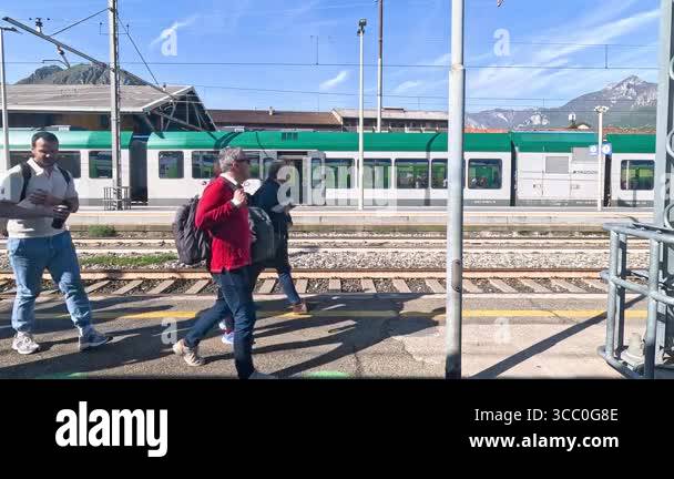 Passengers walking on platform near train Stock Video Footage - Alamy