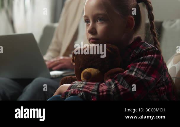 Caucasian family at home father working online with laptop ignoring sad ...