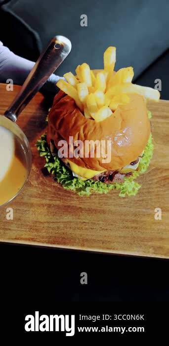 Hamburger, burger. close-up. top view. the waiter is bringing the ...