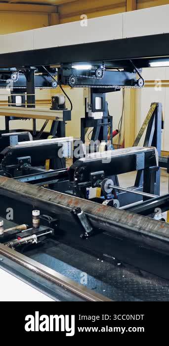 Laser cutting machine for metal pipes. square metal pipe is moving and ...