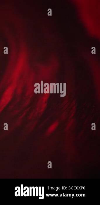 Vertical video. Hot fluid splash. Explosion flame. Defocused red black ...