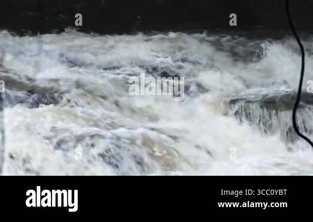 The nature of the waterfall in the forest that flows strongly during ...