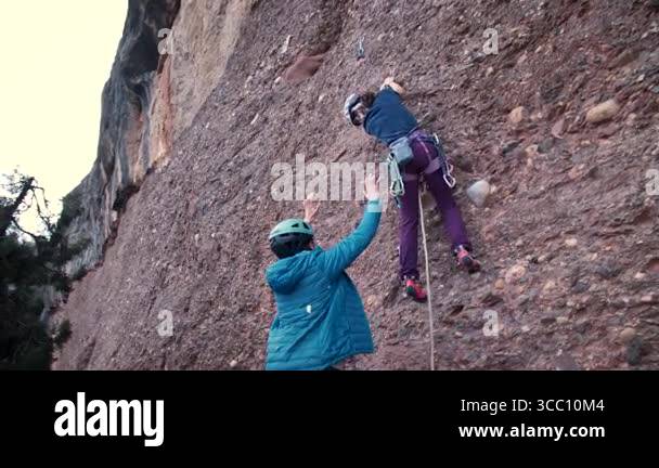 Female friends going climbing on the real rock. High quality 4k footage ...