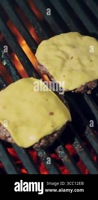 Cookery. cooking burgers. Close-up grilling of fresh meat burger ...