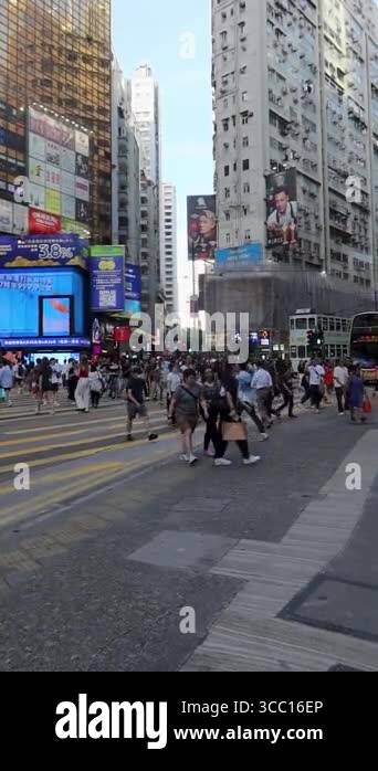 Causeway Bay, Hong Kong- 8 Jun 2025: vertical video of a busy crowd of ...