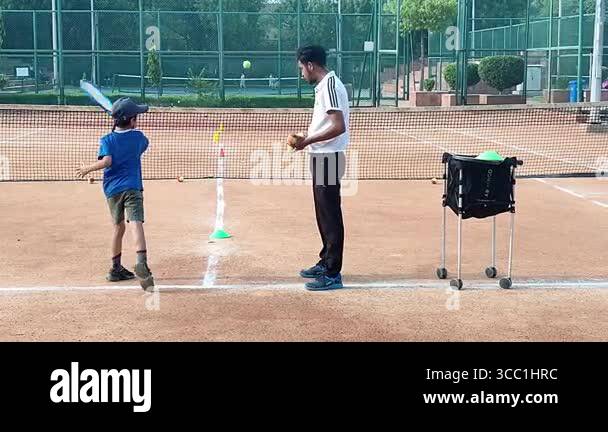 Delhi, India, February 17, 2025 - Junior tennis players having coaching ...