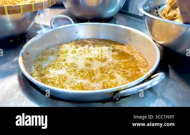 Hot oil boiling in pan at Bangkok floating market stall Stock Video ...