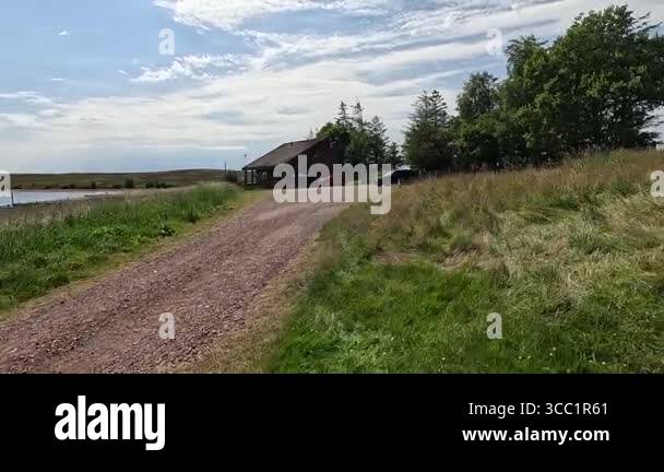 Walking beside the Watch Water Reservoir anglers' clubhouse in the ...