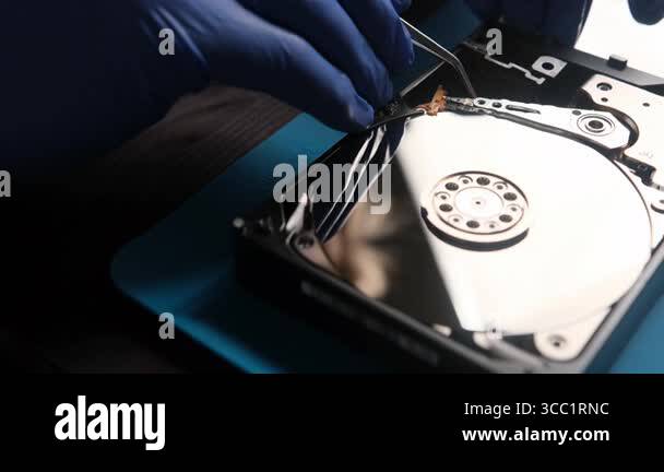 repairman fixing computer hard disk drive in service center Stock Video ...