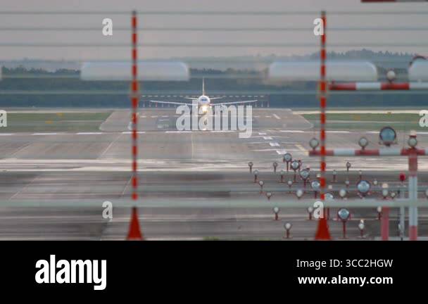 Aircraft speed up before takeoff, view from the end of the runway ...