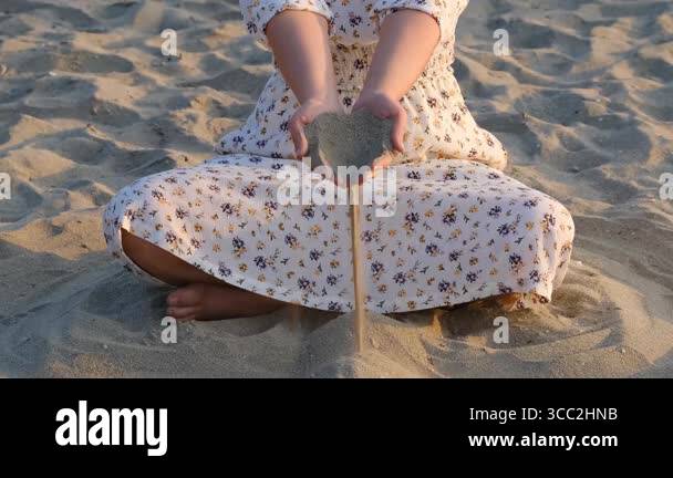 Sand falling from womans Stock Videos & Footage - HD and 4K Video Clips ...