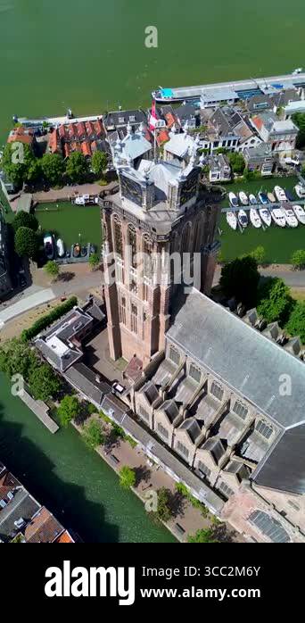 A stunning aerial view of a historic clock tower by the water ...