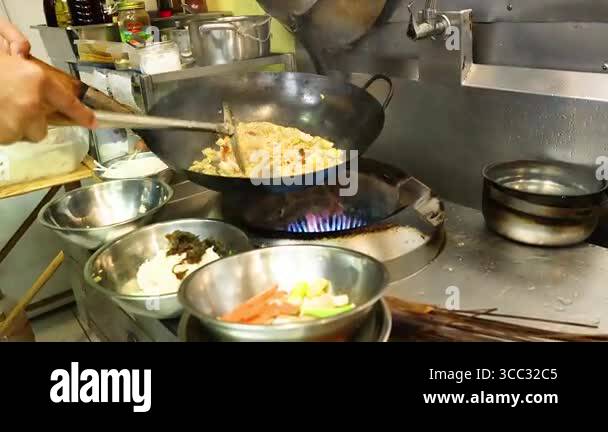 Chef prepares pineapple fried rice in a wok Stock Video Footage - Alamy
