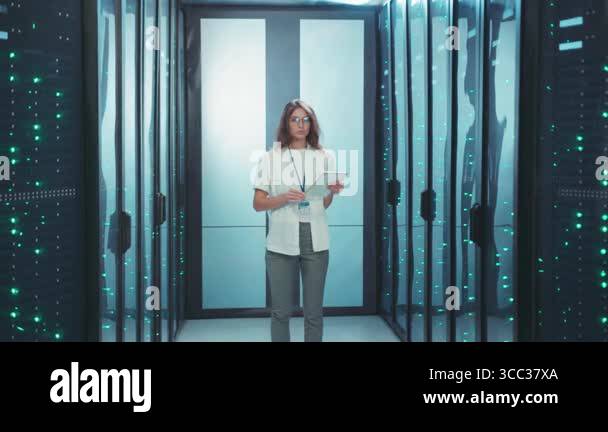 A skilled professional working in a data center, expertly overseeing ...