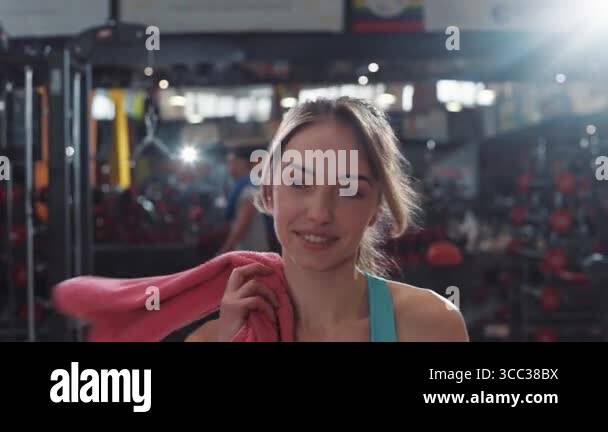 Young happy woman rest walk smile while resting in the gym bottle body ...
