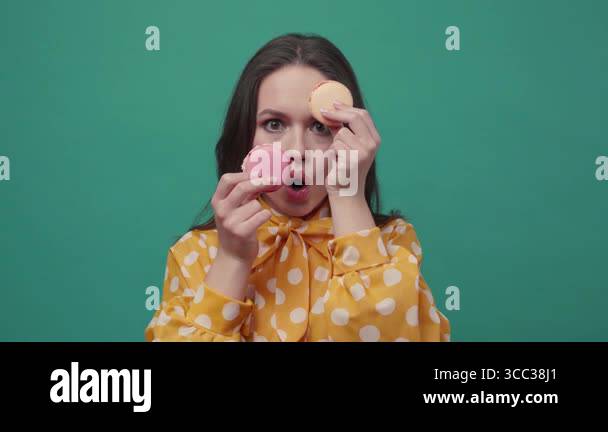 Hilarious young woman with comical face funnily gesticulates with two ...