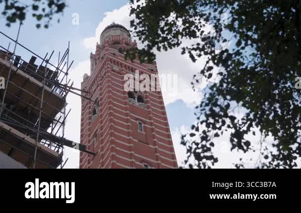 The video shows a large red brick building with impressive architecture ...