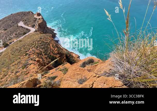 Experience the stunning cliffs that majestically meet the vibrant blue ...