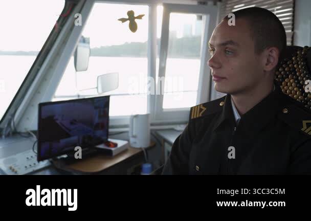 Captain looking out window of ships bridge. Clip Stock Video Footage ...