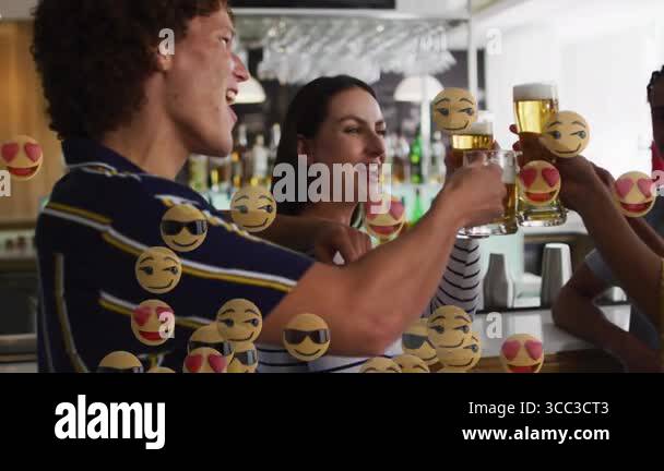 friends bringing beer mugs together at pub counter sparking tech emoji ...