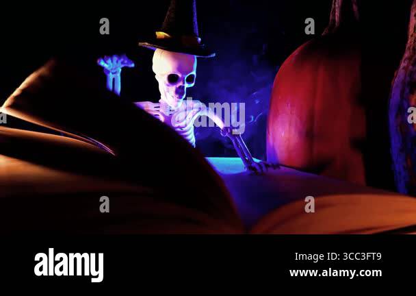 Halloween Books. skeleton leans over the pages of a book in blue smoke ...