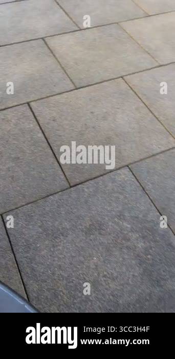 A detailed view of modern stone pavement in an urban setting ...