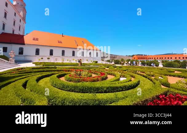 Beautiful circular flower-beds near the historical castle. Territory of ...