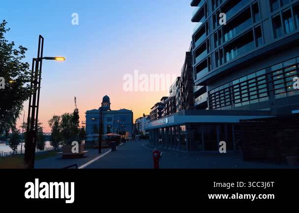 Modern architecture on the quay of the Danube River. Beautiful walk by ...