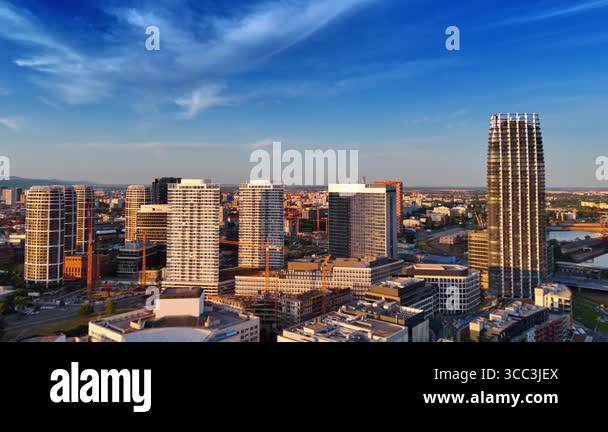 Scenery of modern Bratislava, Slovakia at sunset. Several buildings are ...
