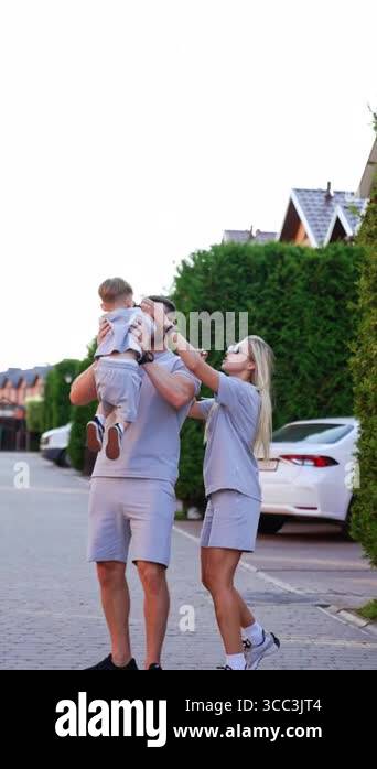 Family enjoying time together outdoors. Family members play with their ...