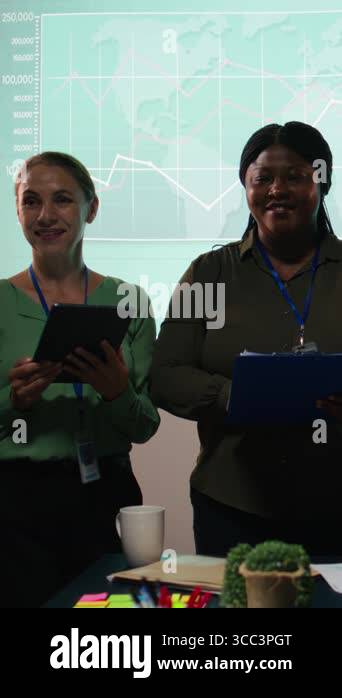 Vertical Video Portrait of employees team preparing a pitch for ...