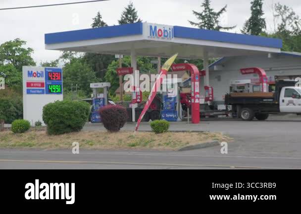 Edgewood WA USA, July 9, 2025 - Mobil gas station Mobil is a major oil ...