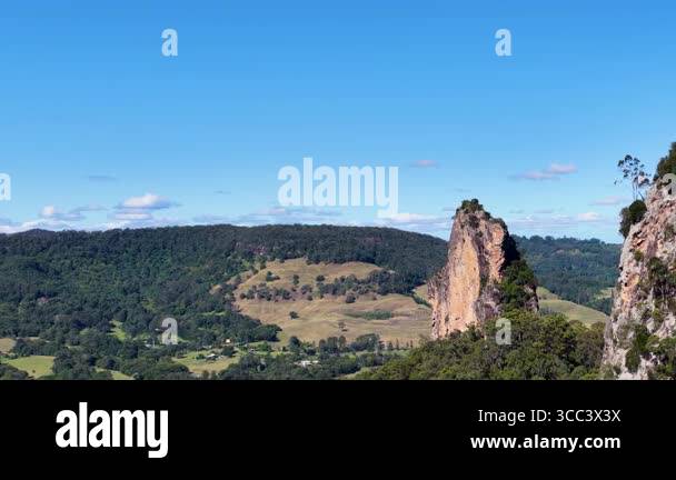Panoramic view of Nimbin Rocks under clear blue skies, showcasing ...
